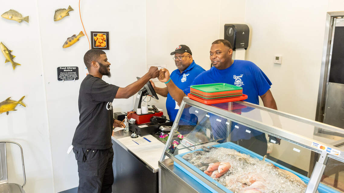 Family, fried fish at Bryant Seafood in Charlotte NC | Charlotte Observer